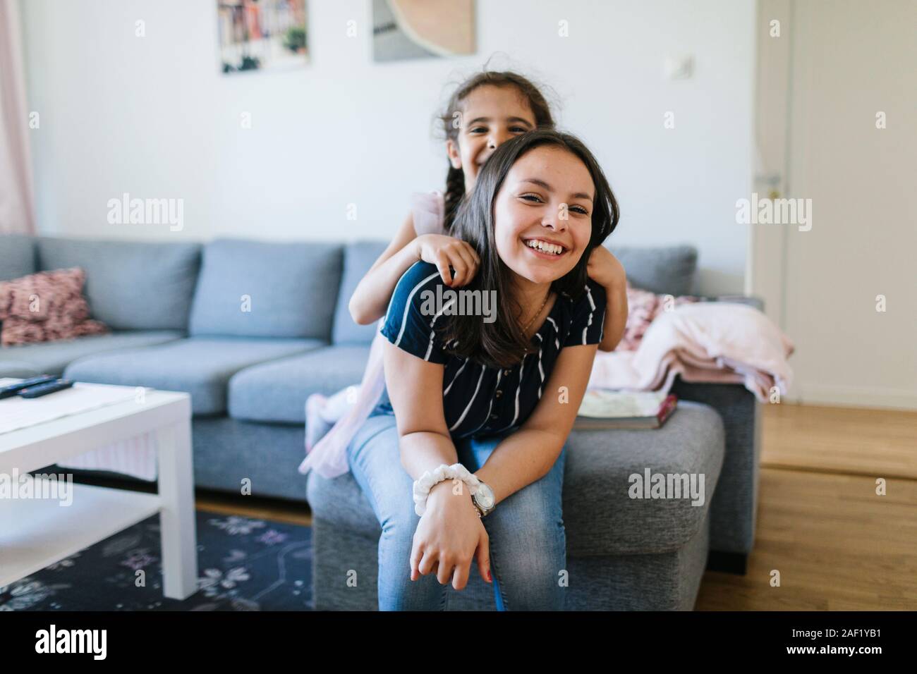 Smiling sisters together Stock Photo - Alamy