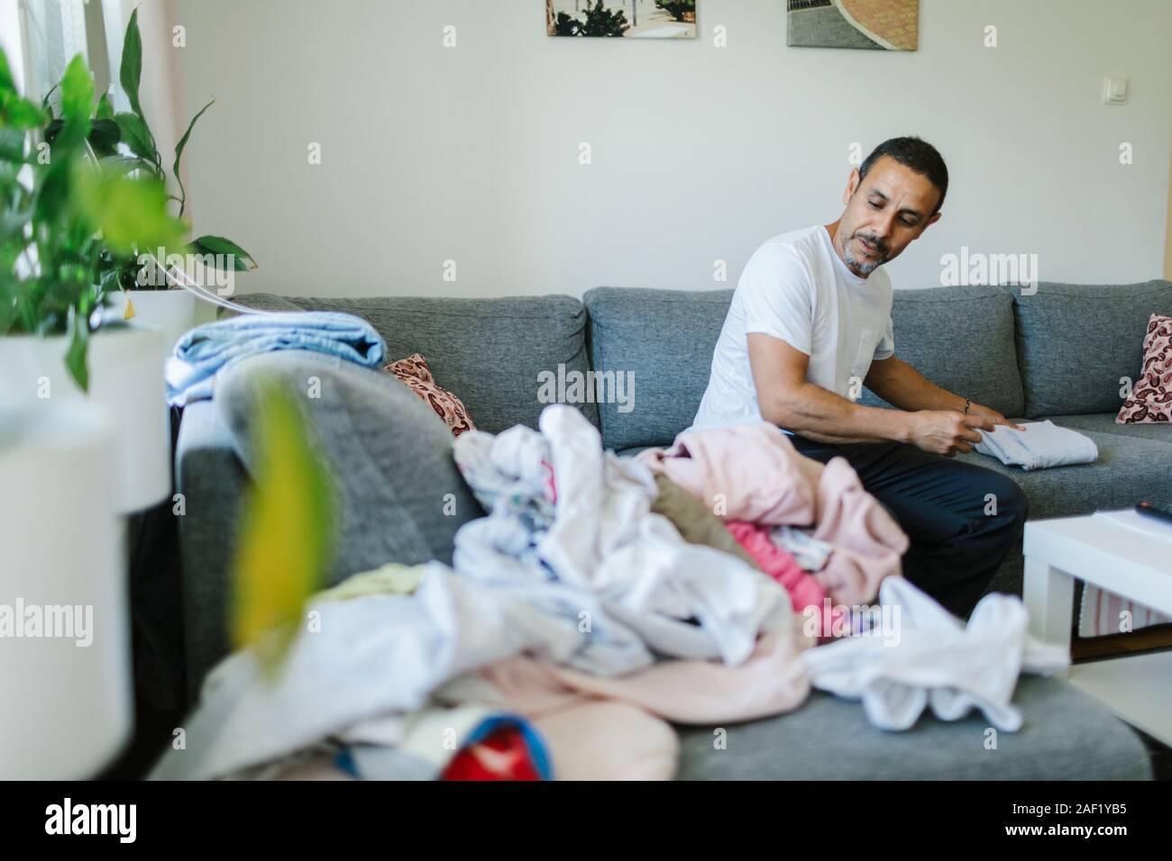 Man Folding Clothes
