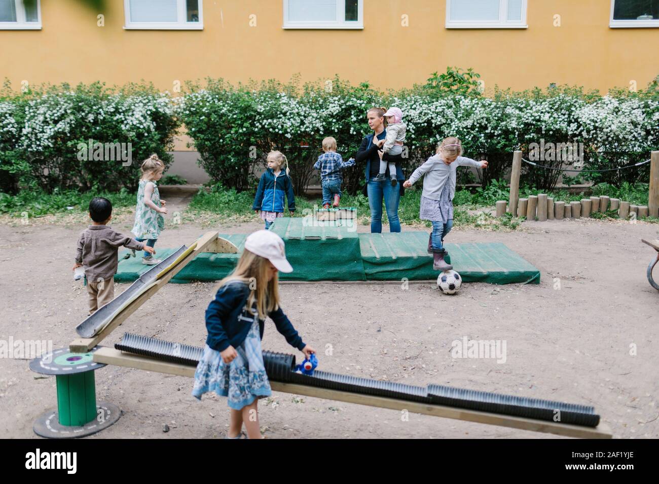 Children playing outside Stock Photo - Alamy