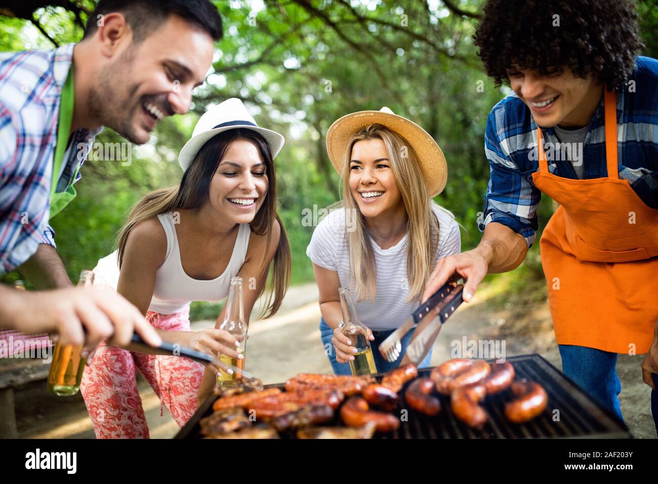 Friends having fun bbq party hi-res stock photography and images - Alamy