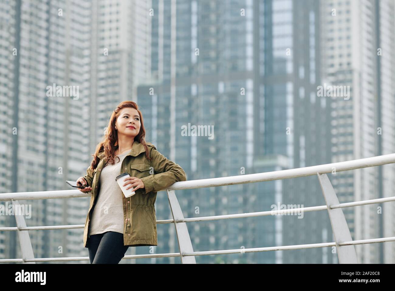 Leaning on bridge railing hi-res stock photography and images - Alamy