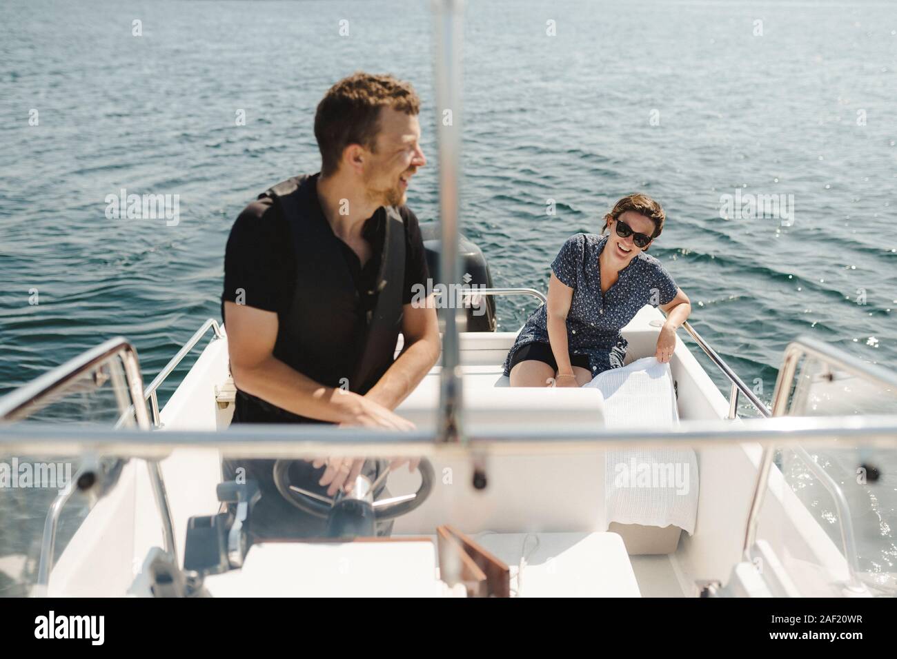 Couple on boat Stock Photo - Alamy