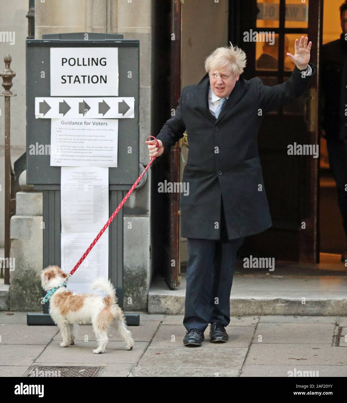 Prime Minister Boris Johnson arrives with his dog, Dilyn, to cast his ...