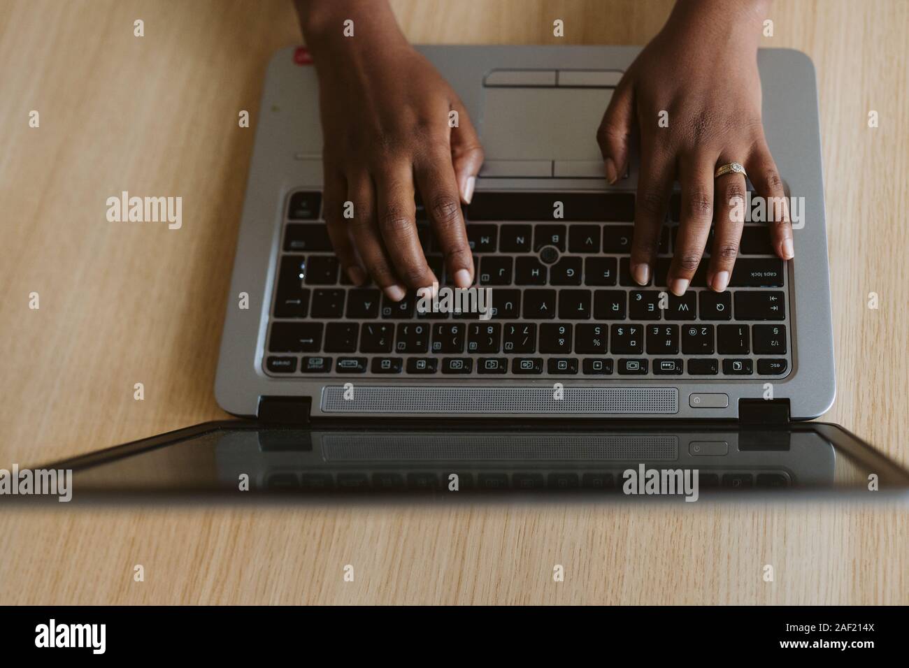 Hands typing on laptop keyboard Stock Photo - Alamy