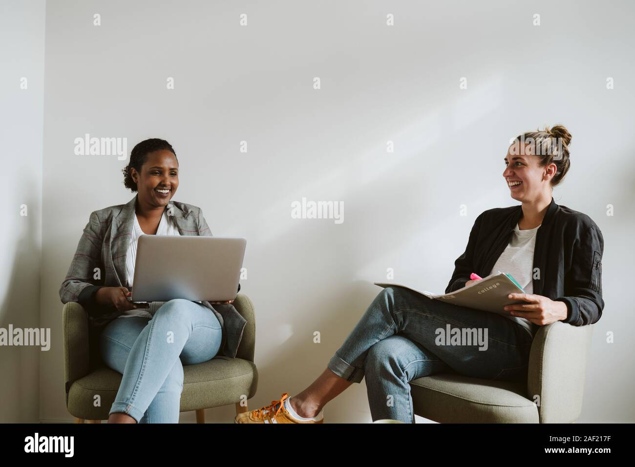 Coworkers talking together Stock Photo - Alamy