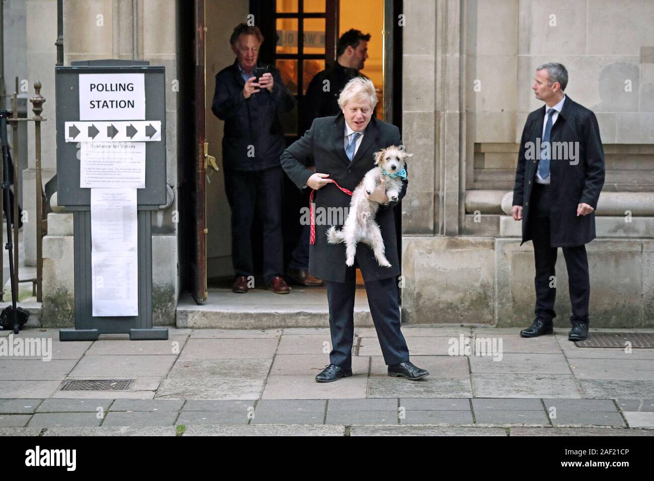 Prime Minister Boris Johnson leaves with his dog, Dilyn, after casting ...