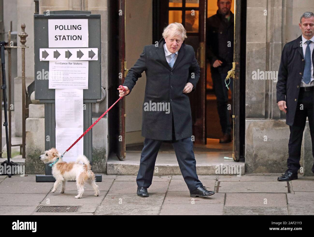 Prime Minister Boris Johnson leaves with his dog, Dilyn, after casting ...