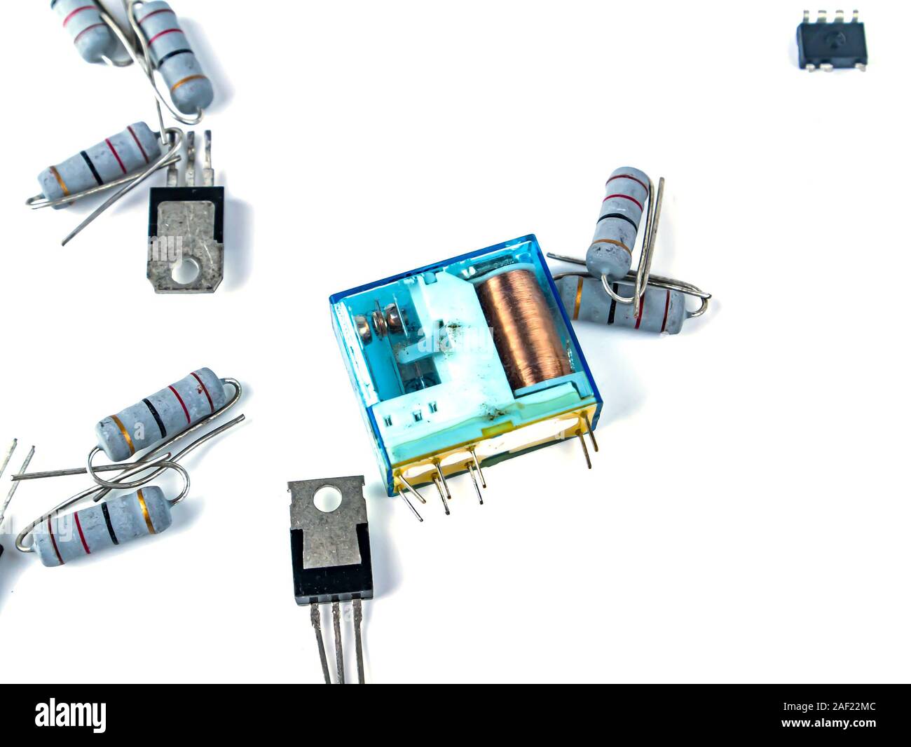 Electronic parts on a white background with place for text. Capacitor ...