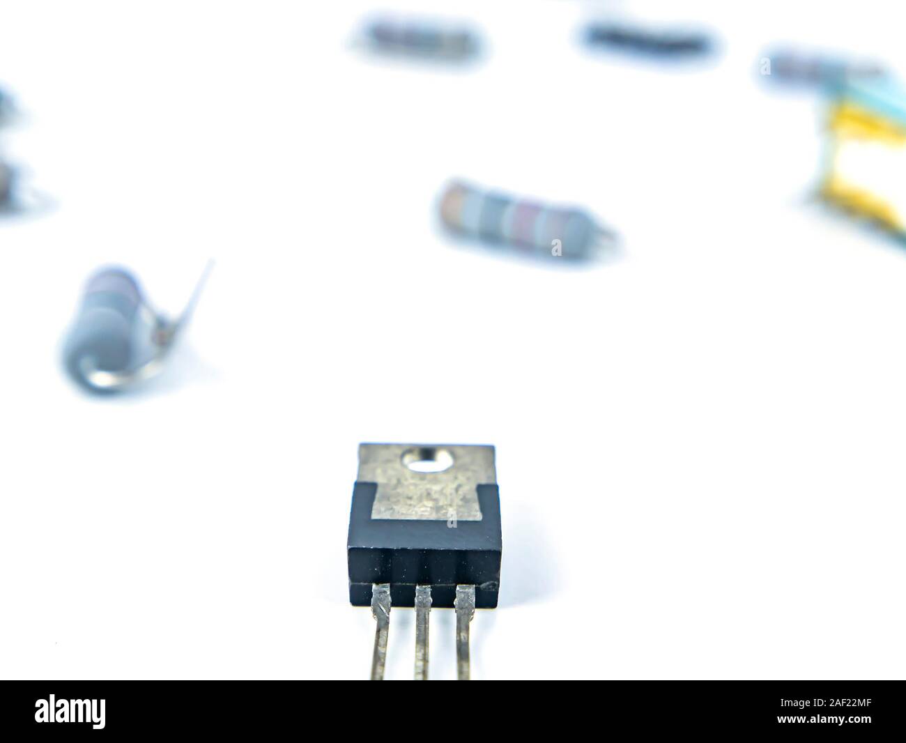 Electronic parts on a white background with place for text. Capacitor ...