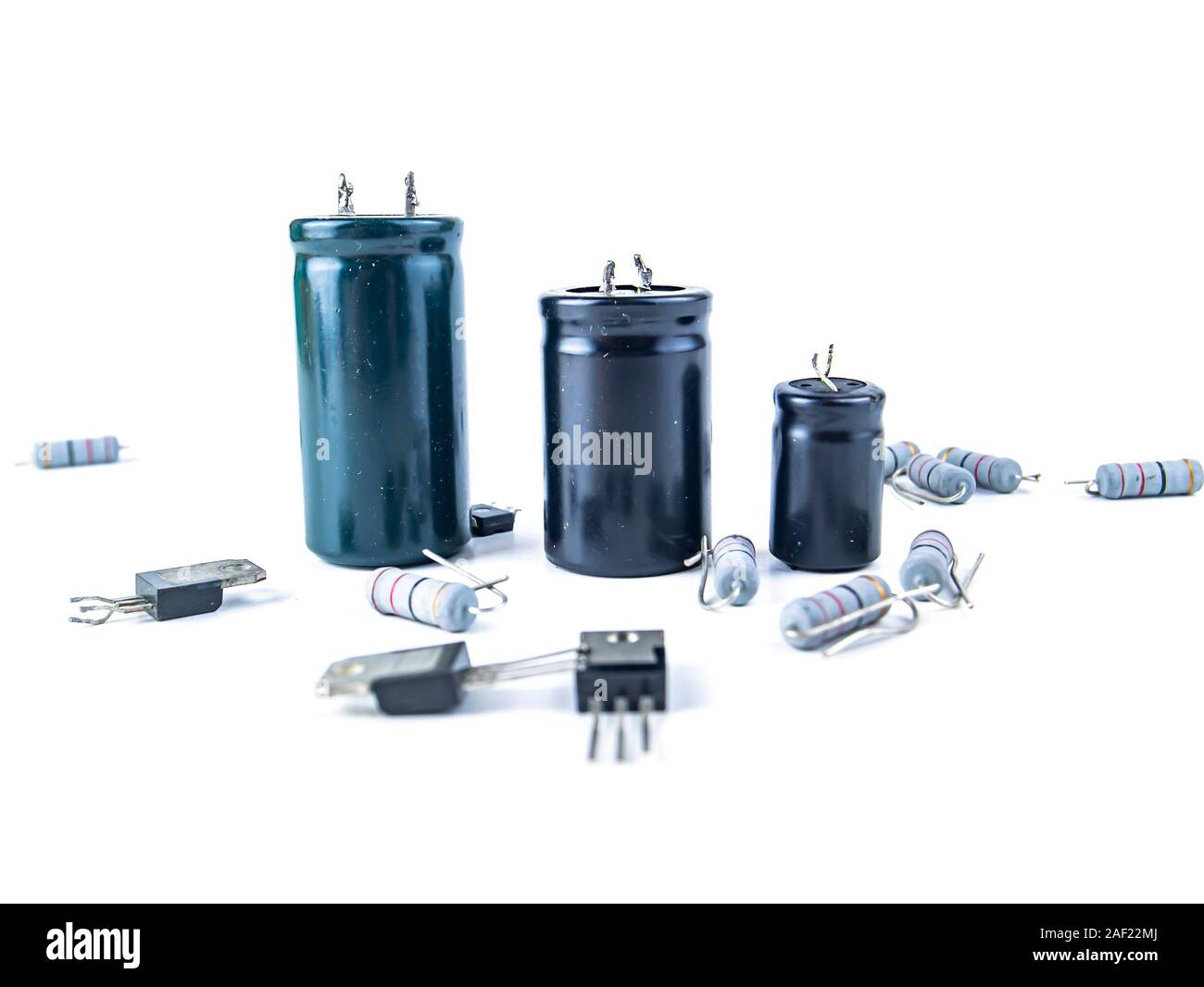 Electronic parts on a white background with place for text. Capacitor ...