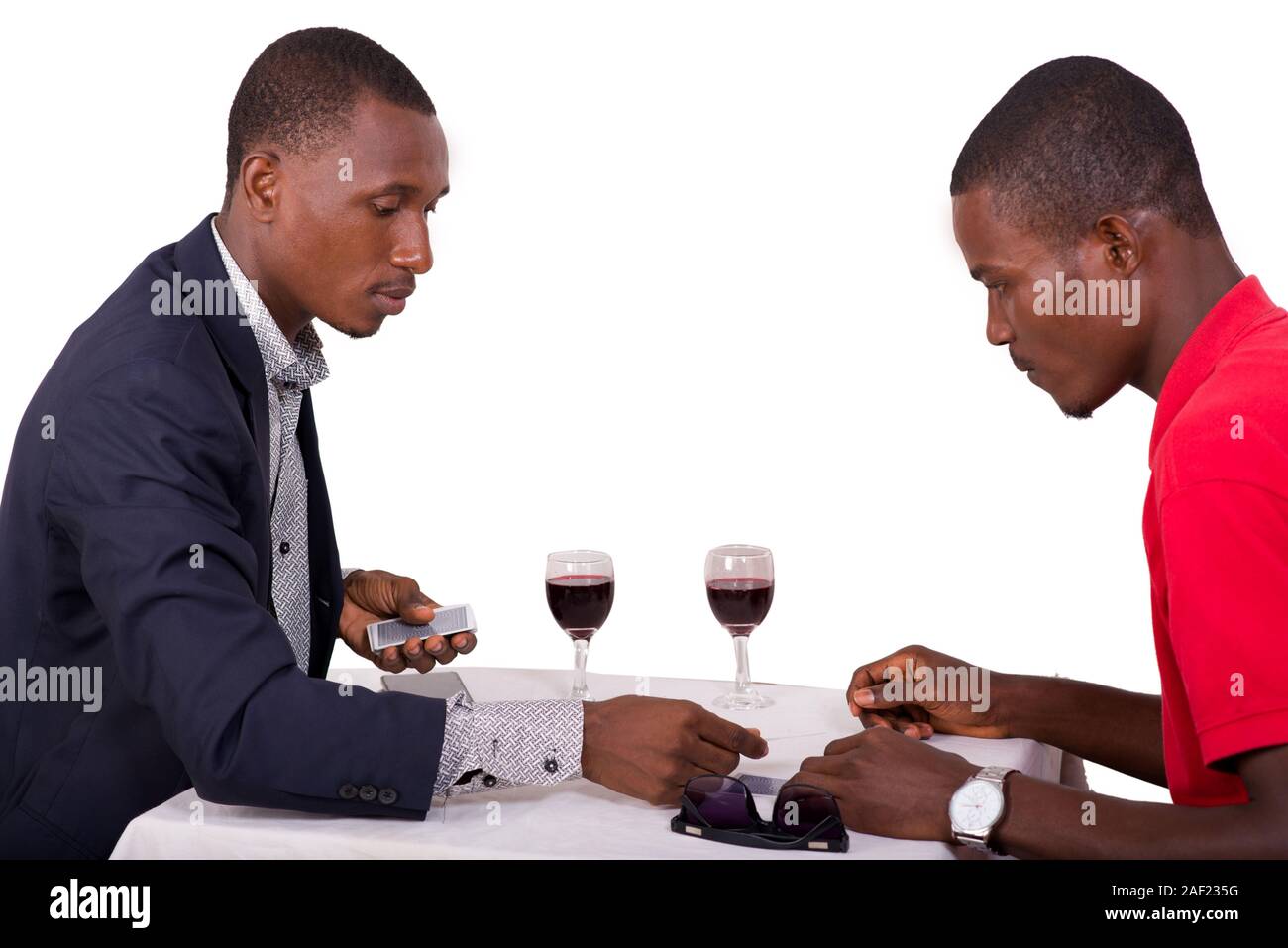 Two young men play cards hi-res stock photography and images - Alamy