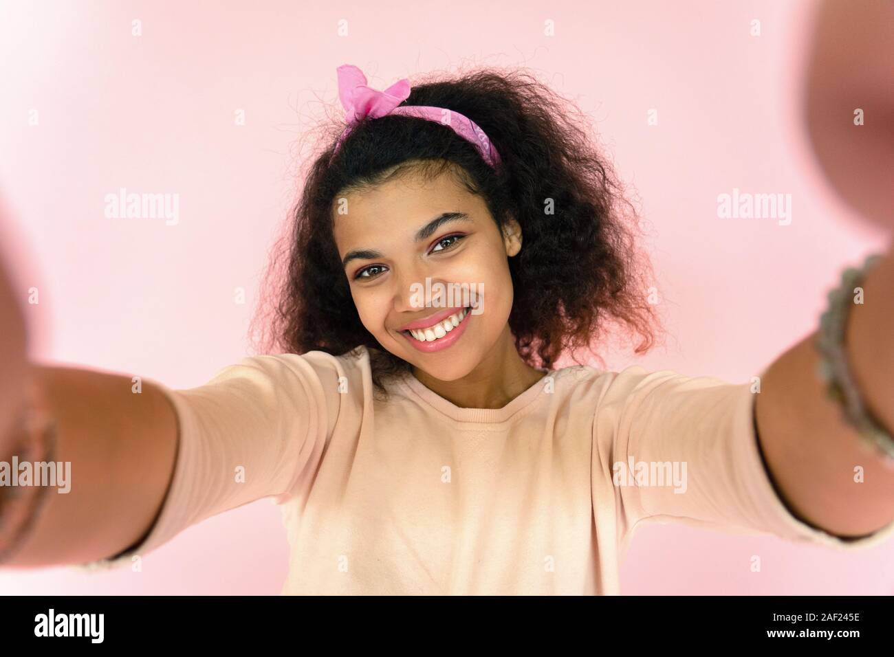 Happy african girl blogger take selfie look at mobile camera isolated ...