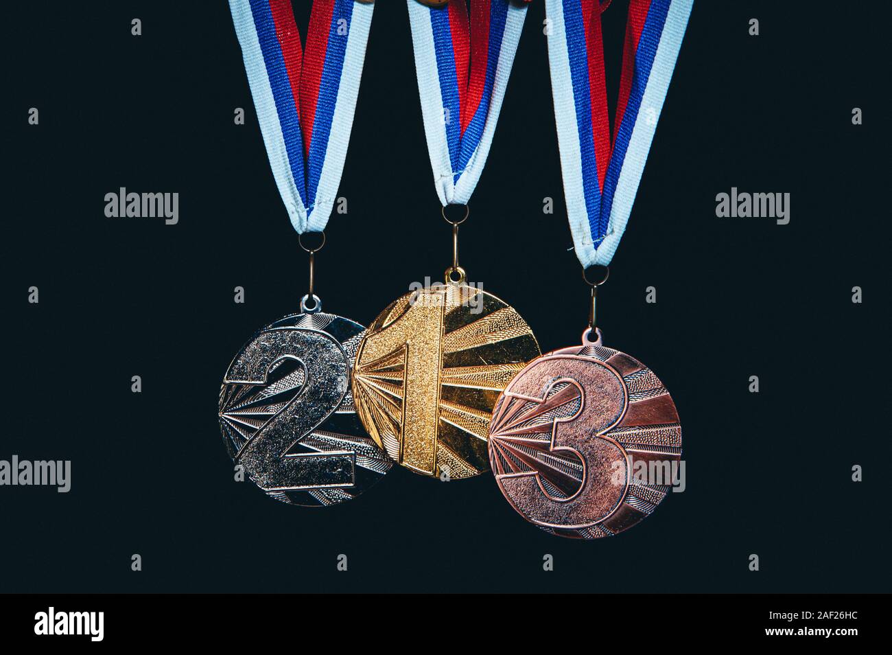Gold silver and bronze medal on black background Stock Photo - Alamy