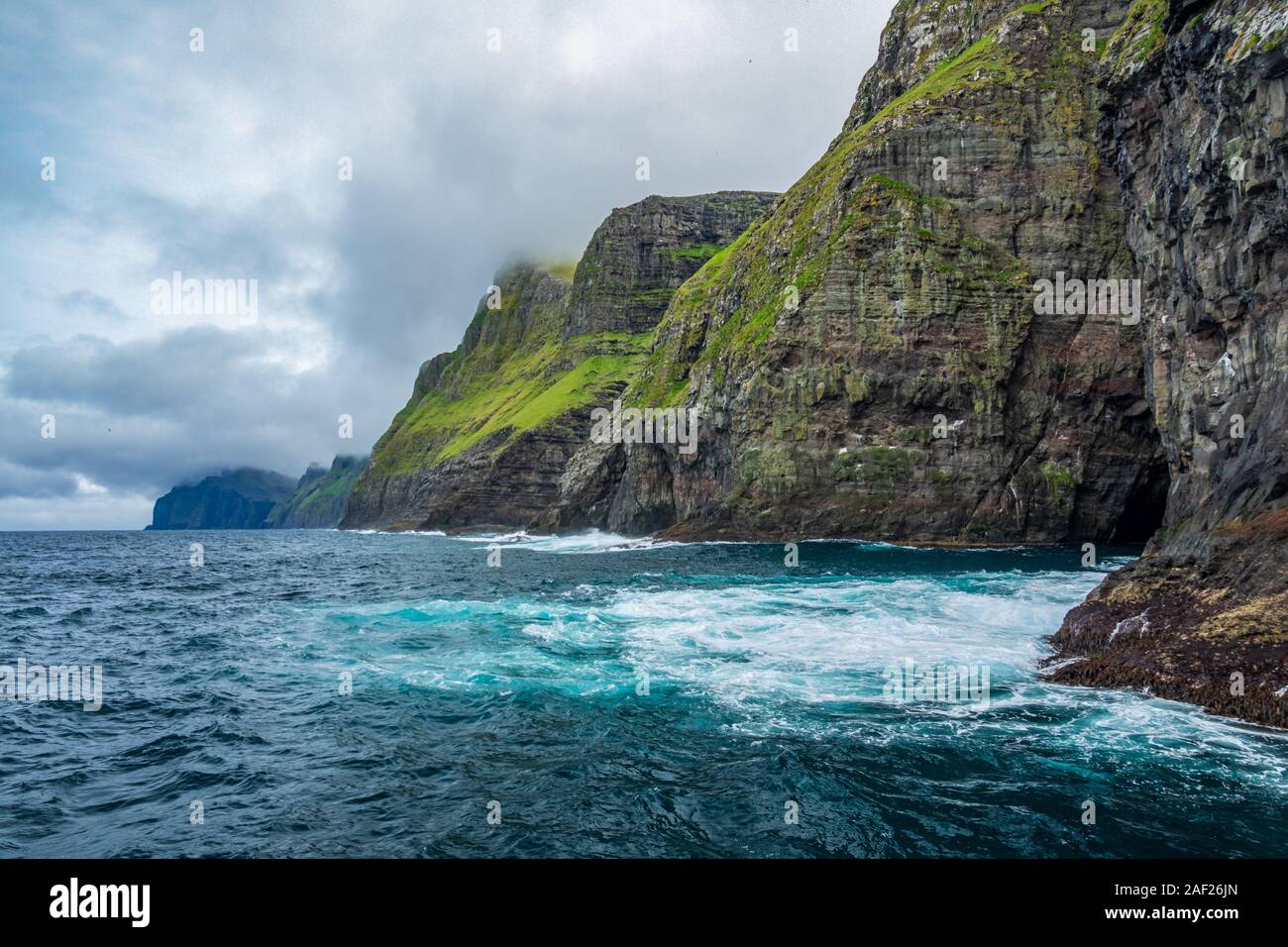 Steep coastline of Faroe islands with spectacular cliffs Stock Photo ...