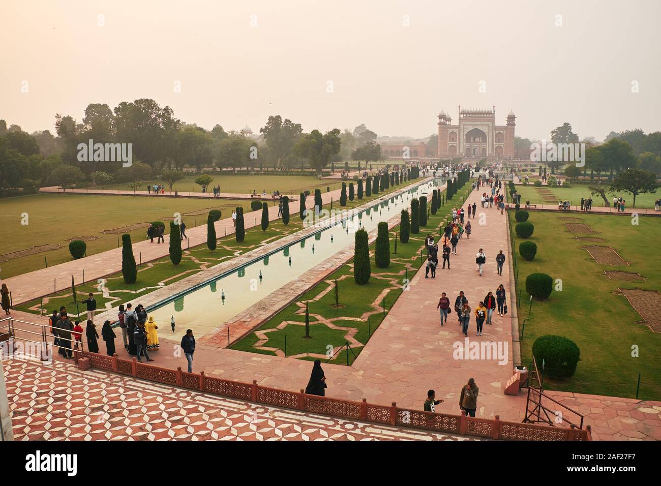 Taj Mahal park and garden view with many tourists. Agra, India, 01.12. ...