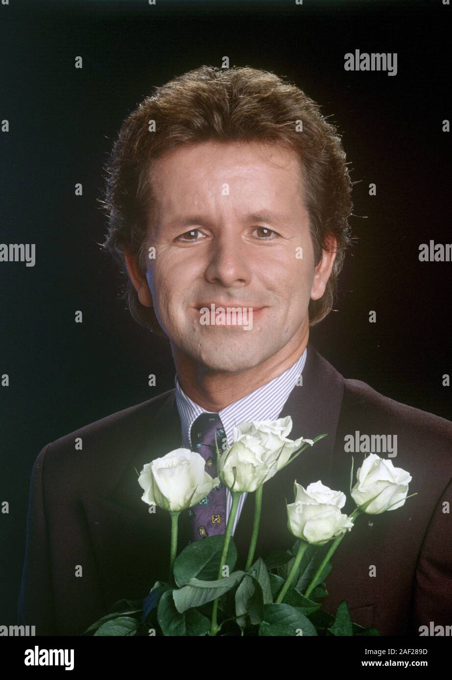 G.G. Anderson in September 1992 with a bouquet of white roses. He was ...