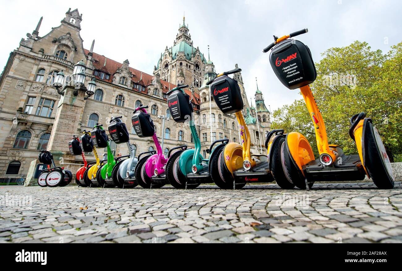 Colorful segways on a square in front of the new town hall in the ...