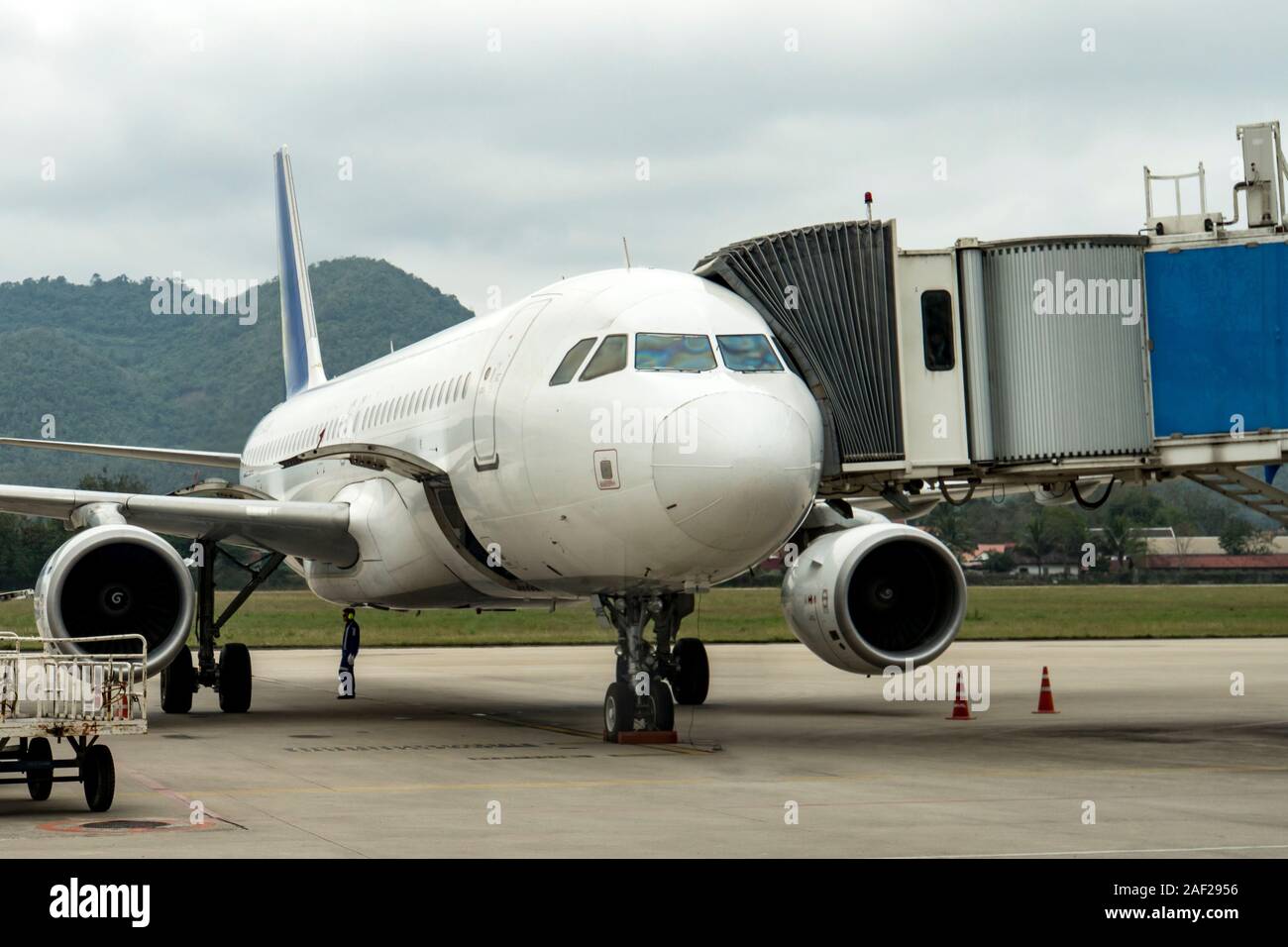 Boarding plane terminal. Airplane at the gate in airport. An airplane ...