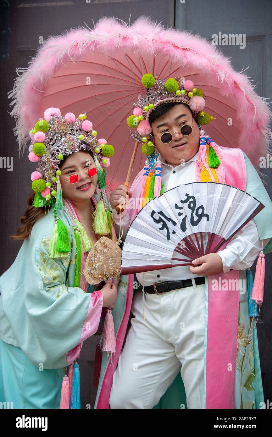 Shanghai, China - November 2019: Young couple dressed in colourful ...