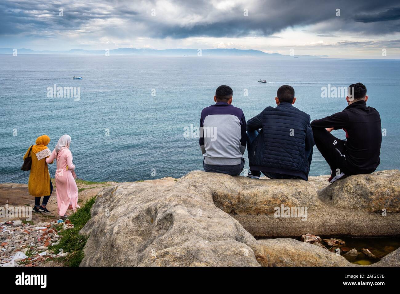 Morocco, Tangier: men sitting on the hill of Marshan, facing the Strait ...