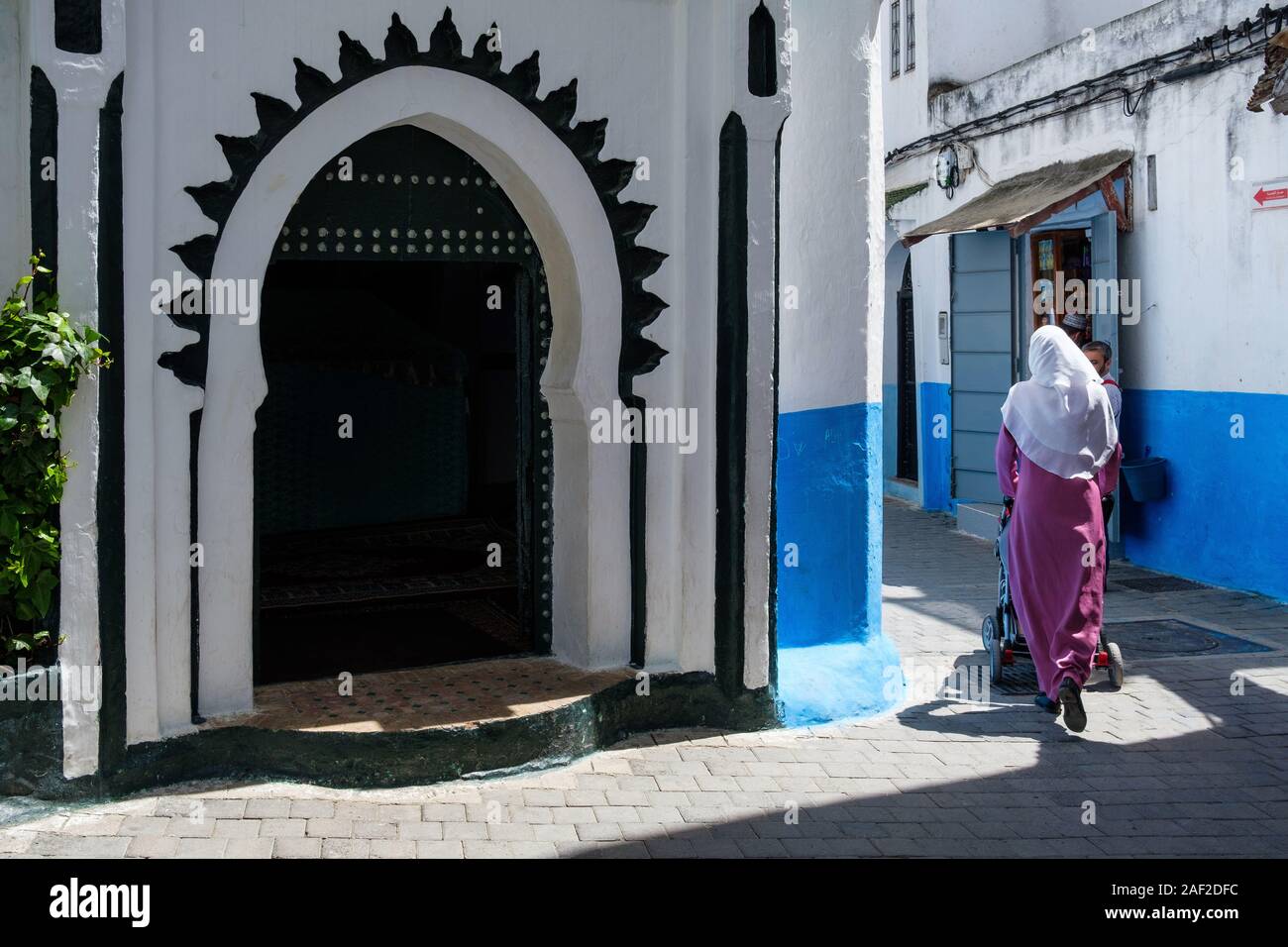 Morocco, Tangier: woman with a stroller in a lane of the medina Stock ...