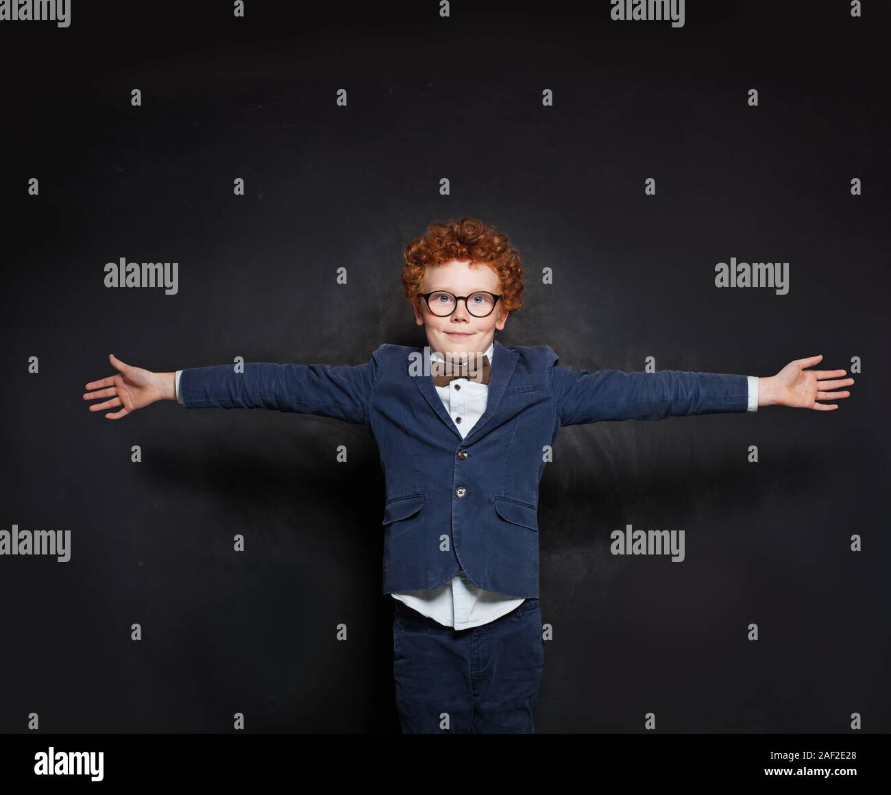 Happy child student on blackboard background with science and maths ...