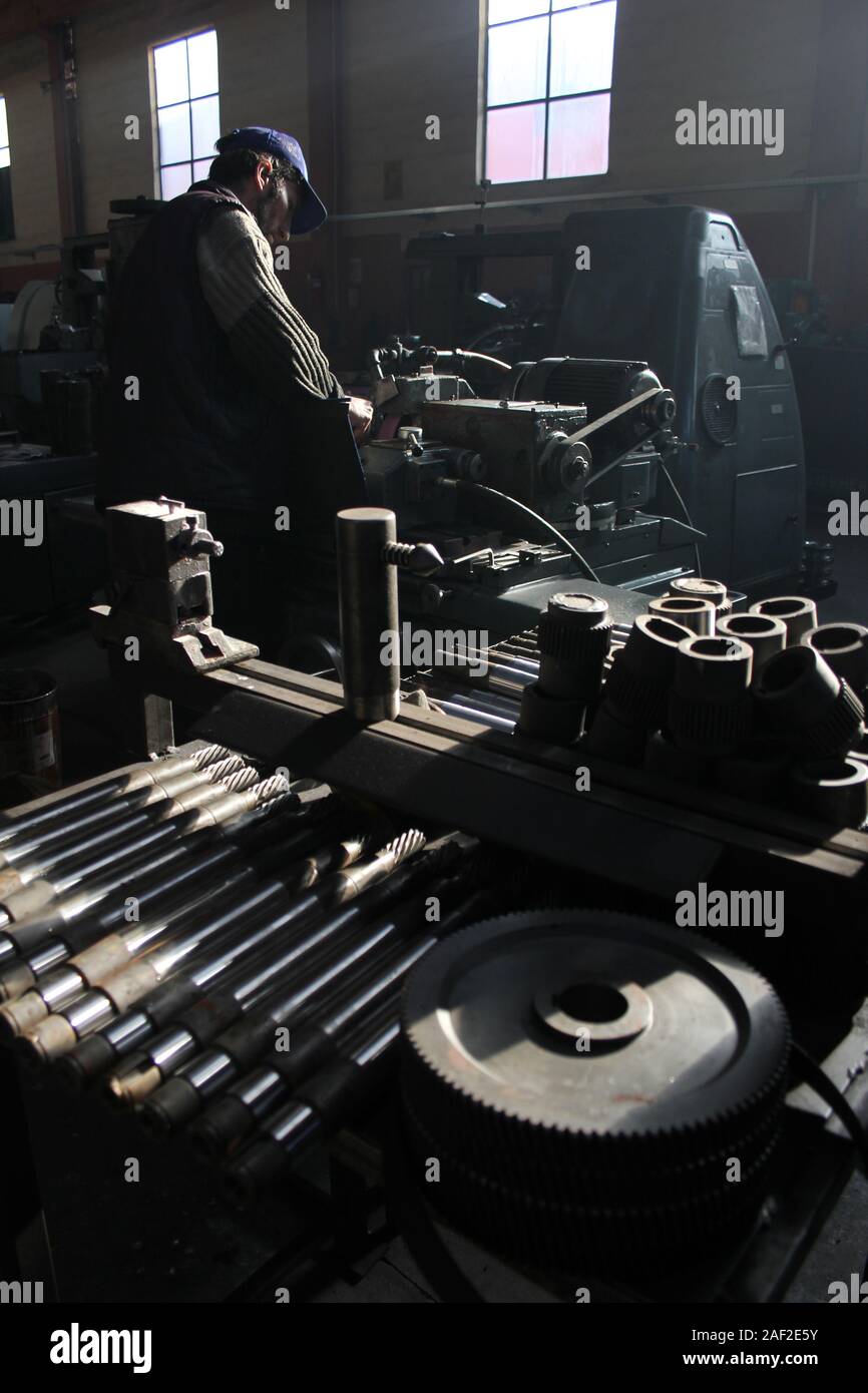 worker operating lathe machine Stock Photo - Alamy