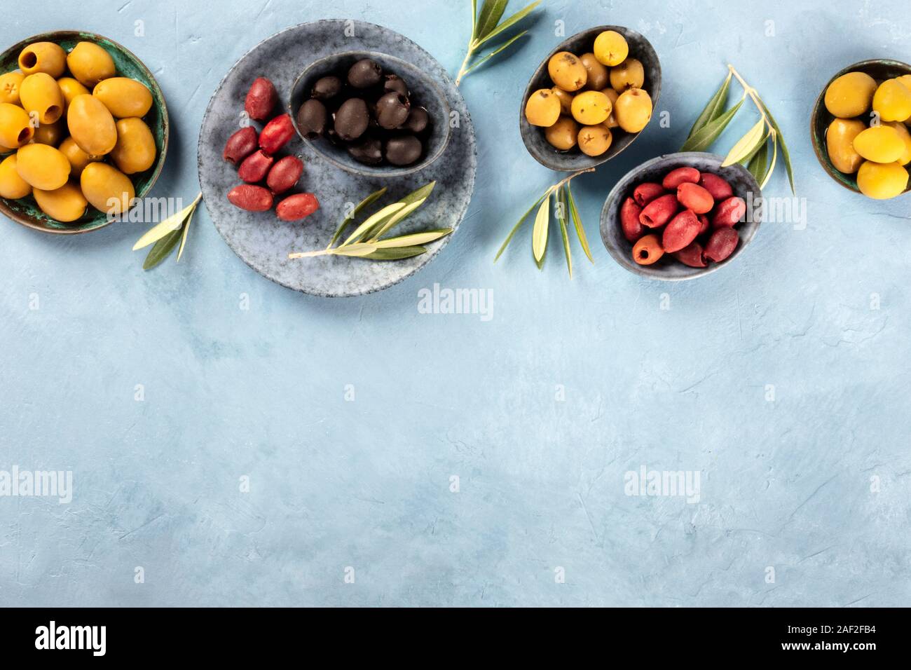 Olives flat lay overhead shot with a place for text. Black, green and ...