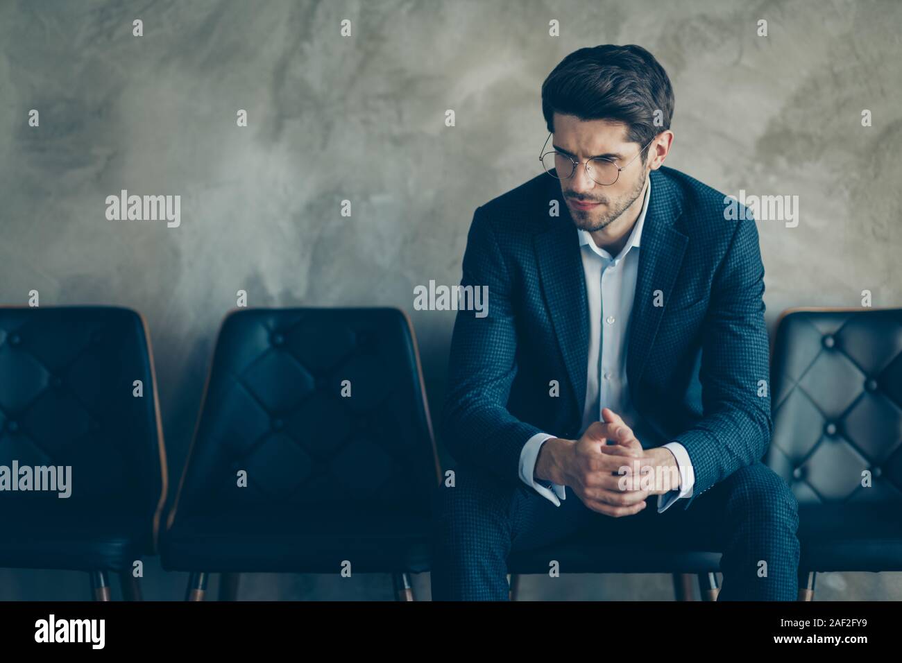 Portrait of sad guy feel nervous wait for meeting with new boss hr ...