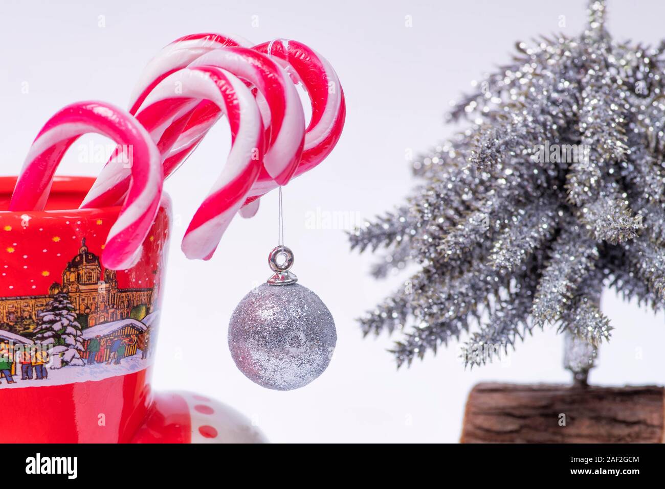 Red and white candy canes in red cup.Christmas candy canes in a red cup ...