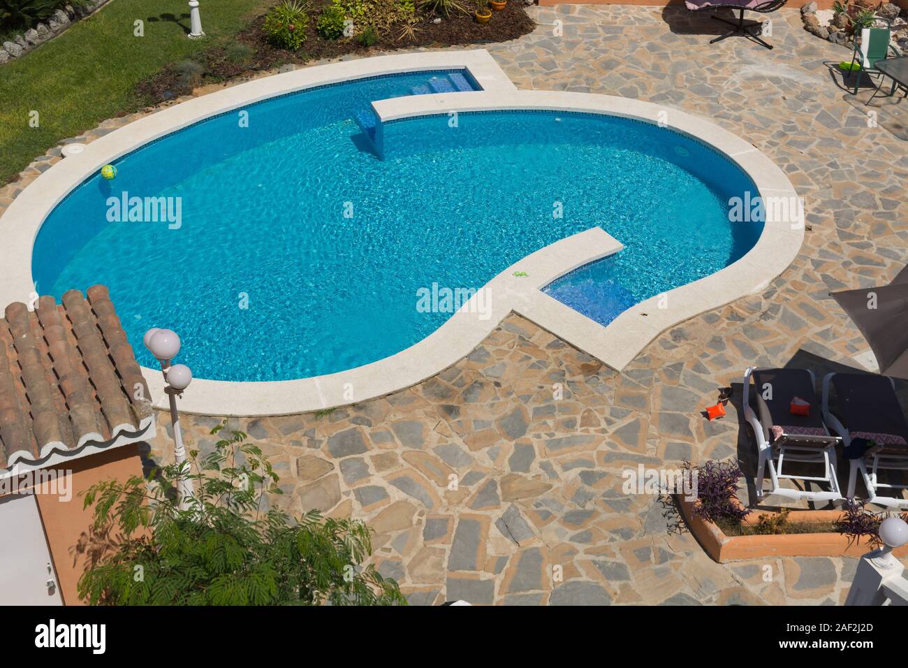 A beautiful luxury swimming pool at a villa in the holiday destination ...
