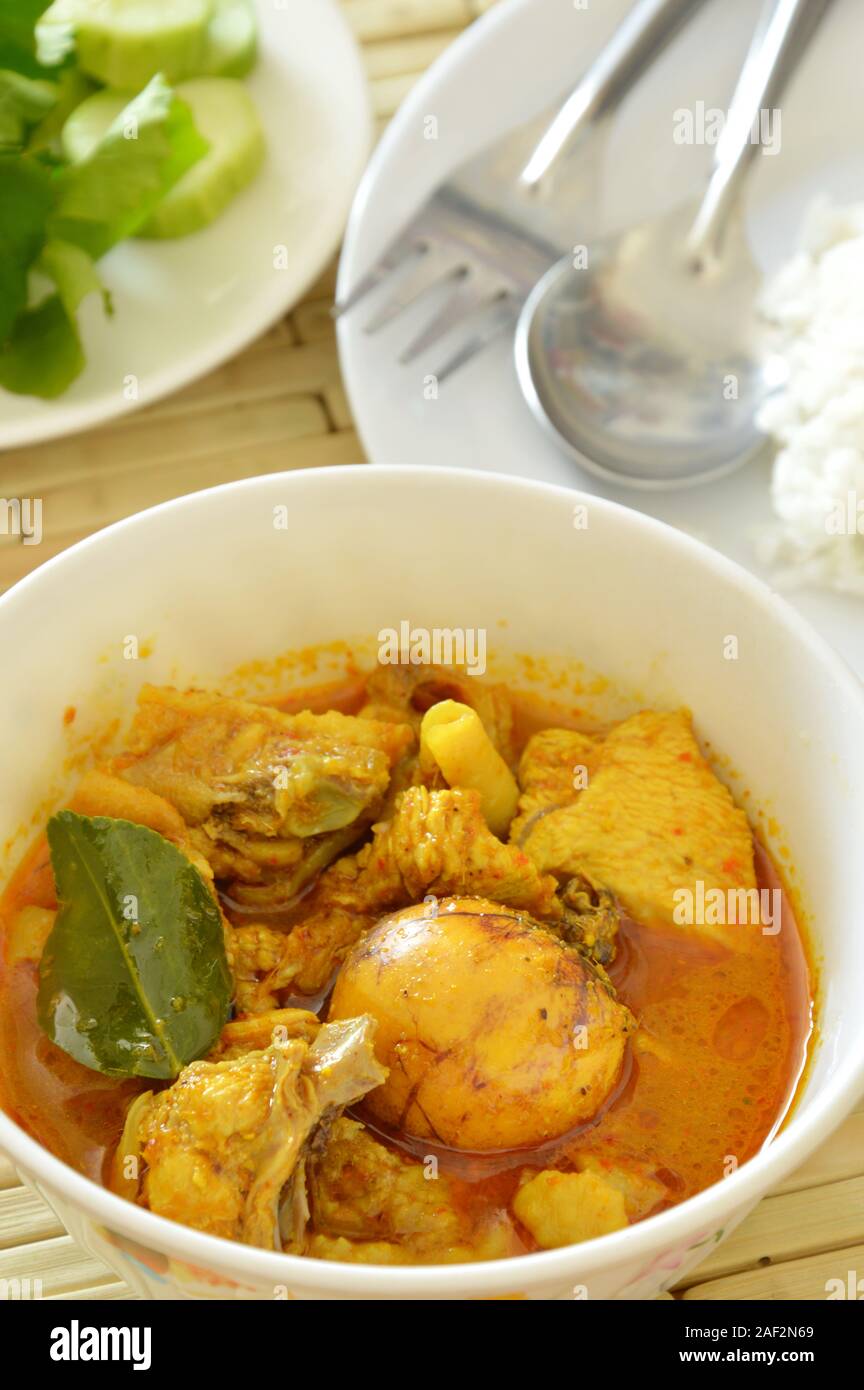 spicy chicken with egg spoiled while being incubated curry and rice ...
