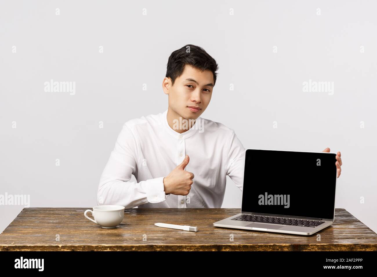 Man giving advice what you should buy. Handsome and confident ...
