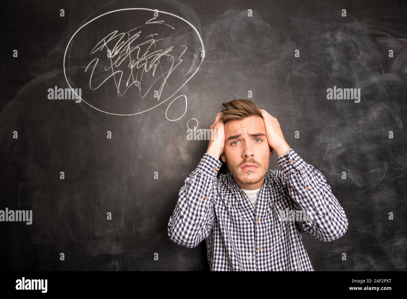 Portrait of young cute man with expression of pain on his face Stock ...