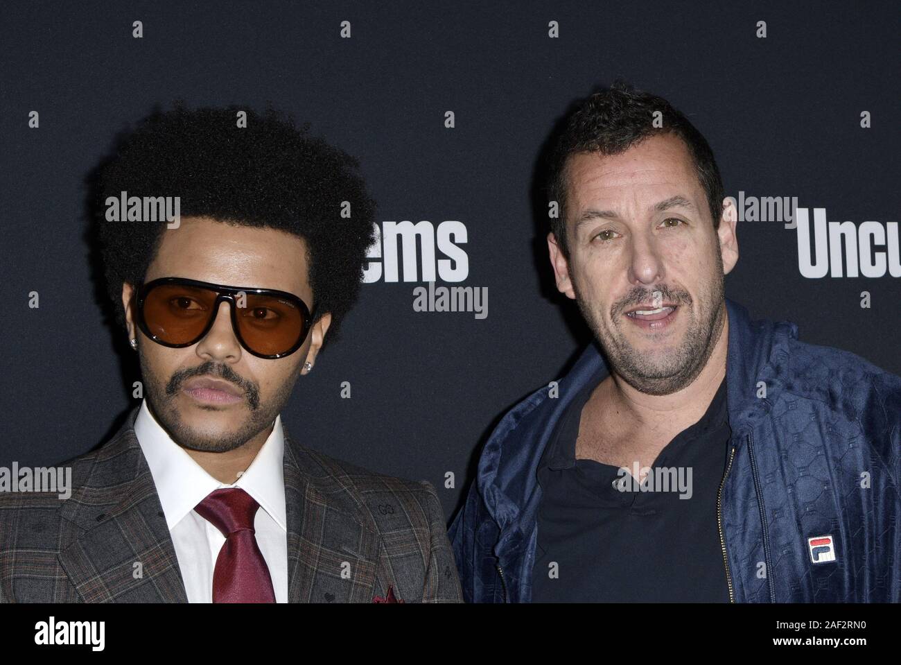 HOLLYWOOD, CA - DECEMBER 11: The Weeknd, Adam Sandler, at Premiere Of ...
