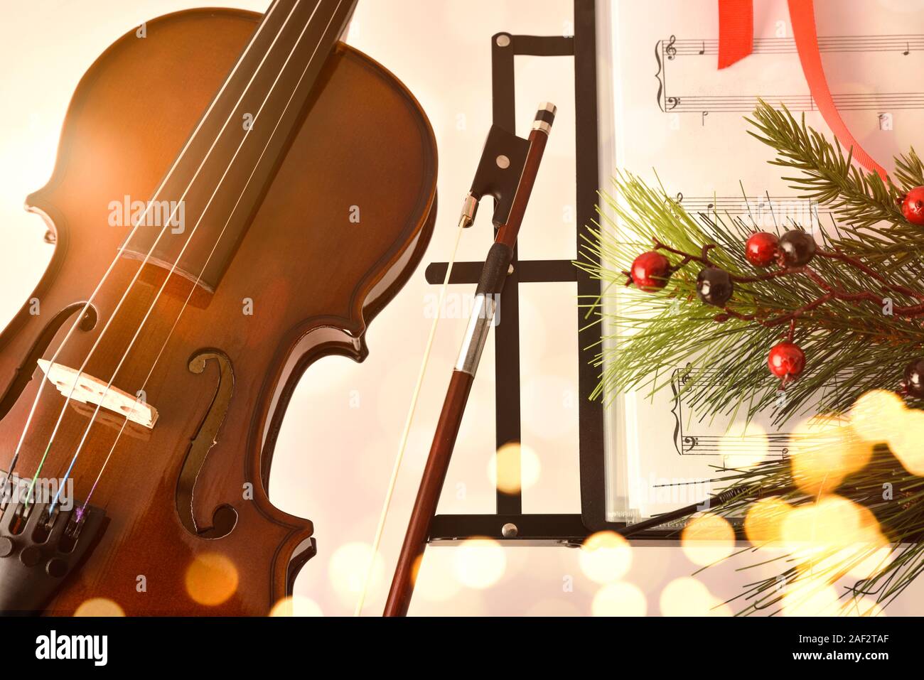 Christmas concert concept with violin and music stand and decoration ...