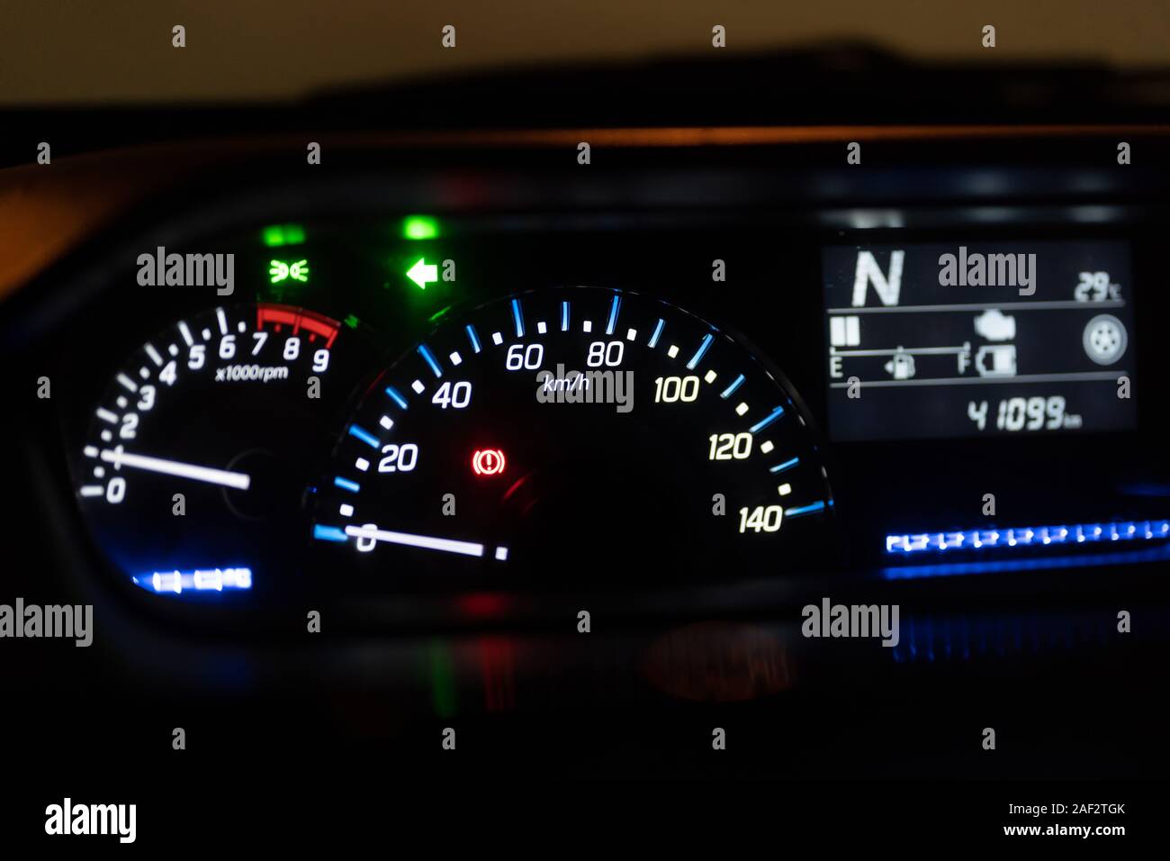 Modern car illuminated dashboard closeup Stock Photo - Alamy
