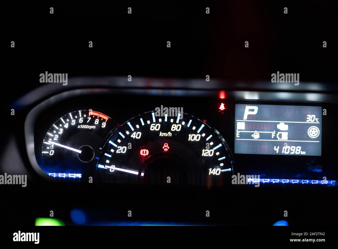 Modern car illuminated dashboard closeup Stock Photo - Alamy