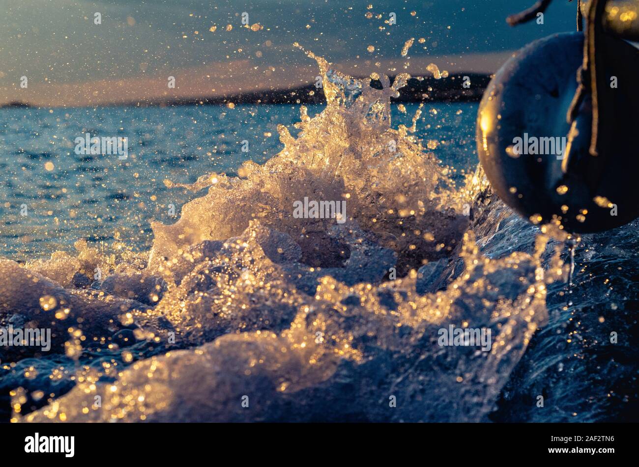 Drop splashing into water drop side hi-res stock photography and images ...