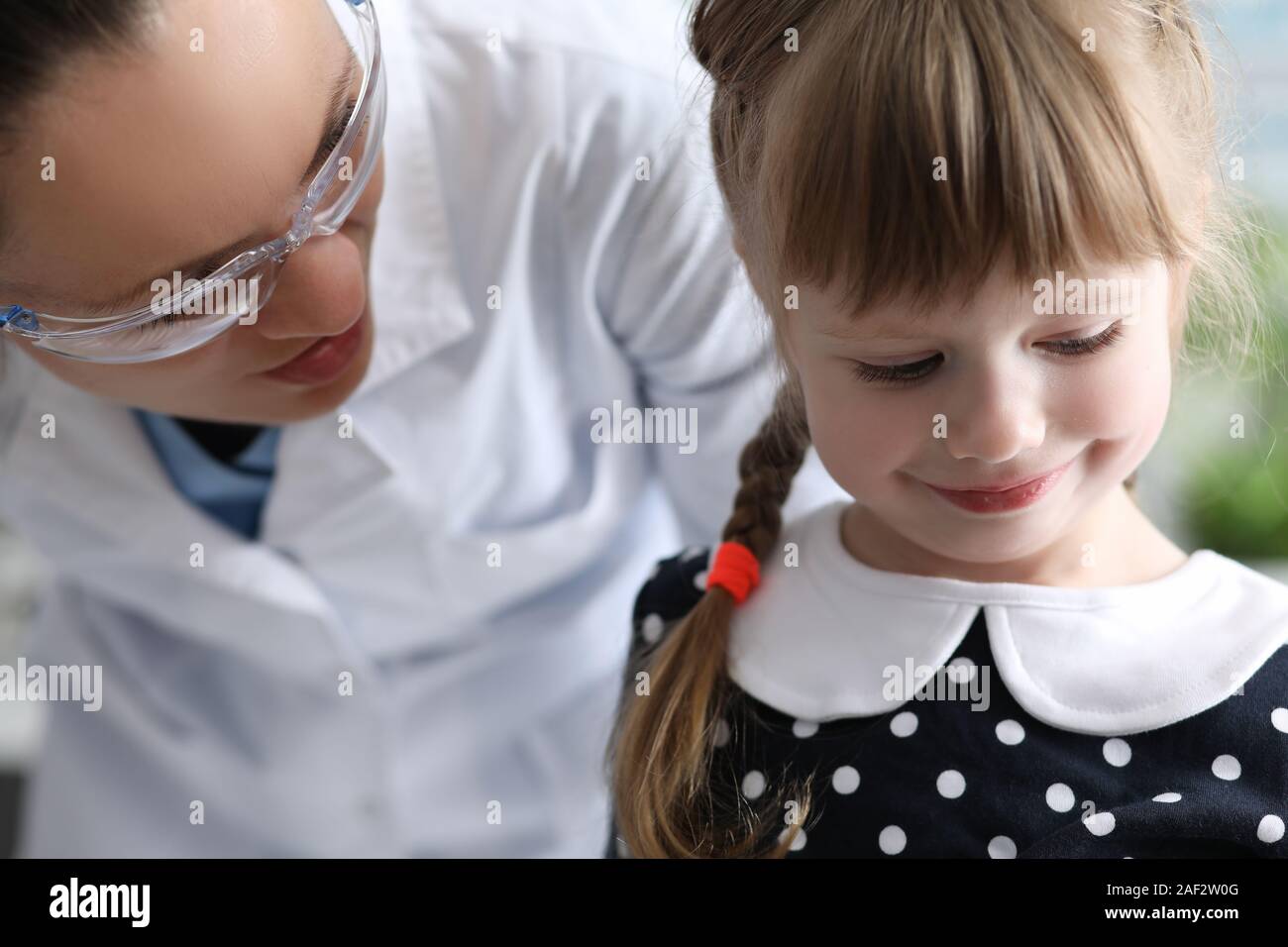 Little kid with doctor Stock Photo - Alamy