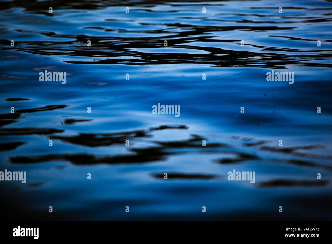Dark blue waves of the water Stock Photo - Alamy