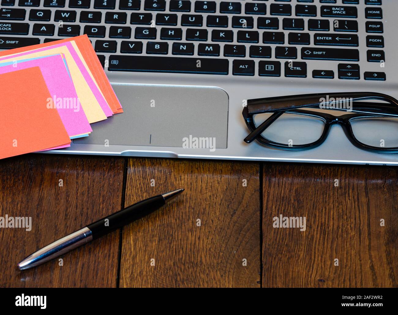 Different objects on wooden office desk. Modern wooden office desk ...