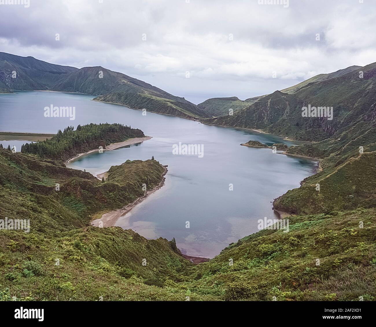 Colourful landscape scene looking across the volcanic crater lake of ...
