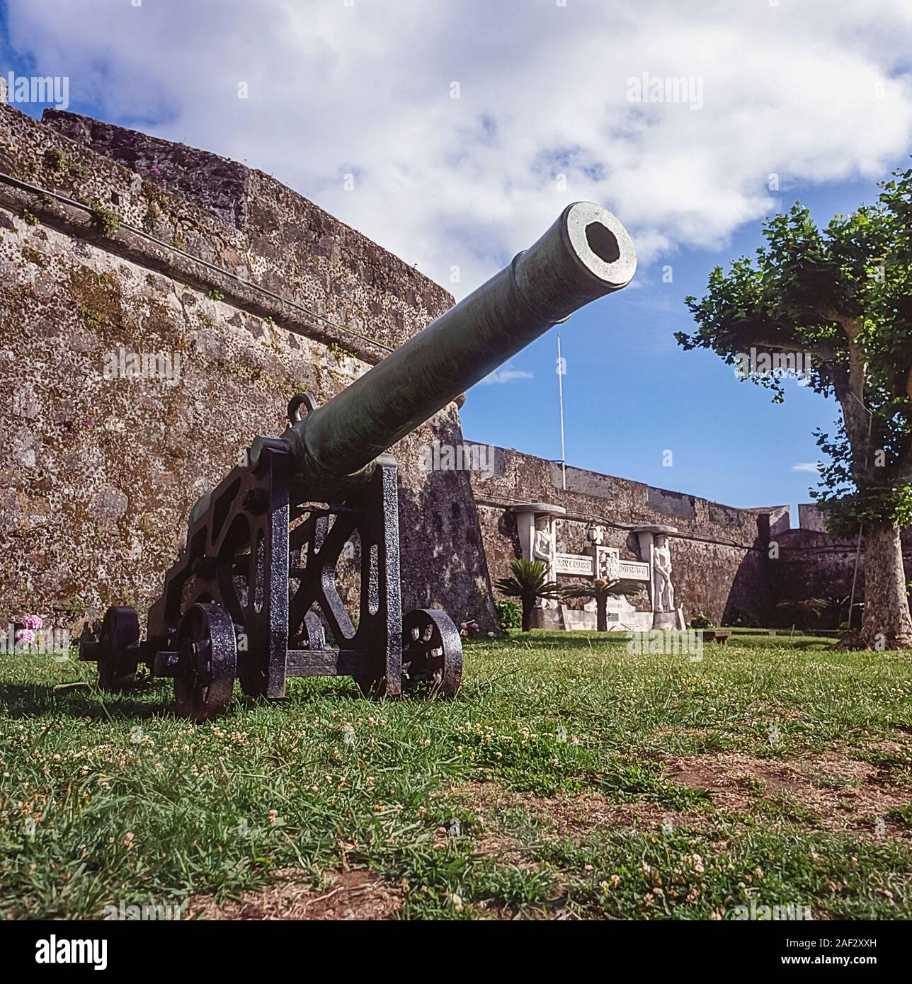 The colourful island of Faial with an old 18th century cannon at the ...