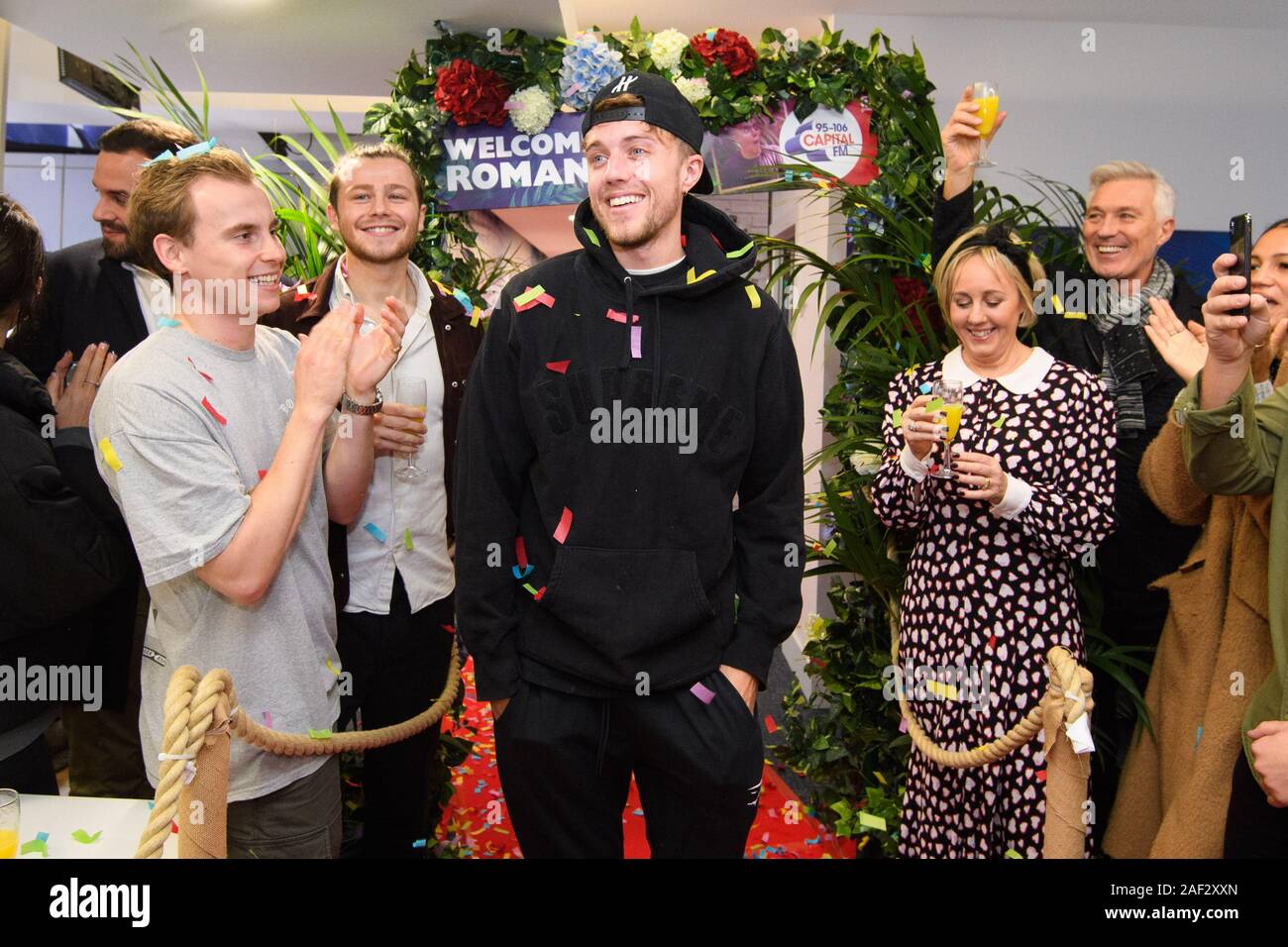 Roman Kemp is greeted by friends and family, including parents Shirlie and Martin Kemp (right ...