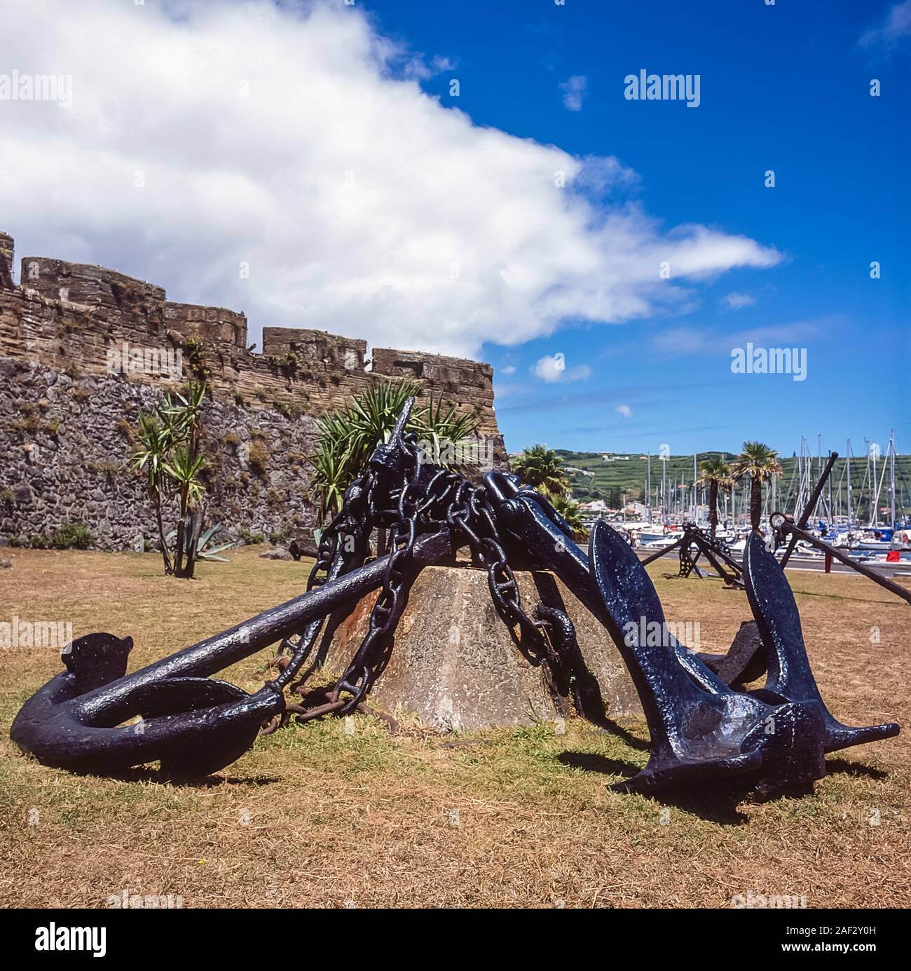 The colourful island of Faial with old ships anchors at the old ...