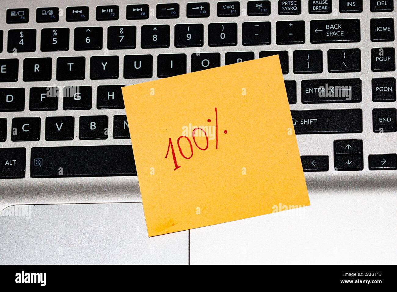 Writing on colorful sticky note 100%. Text with 100% on paper. Sticky ...