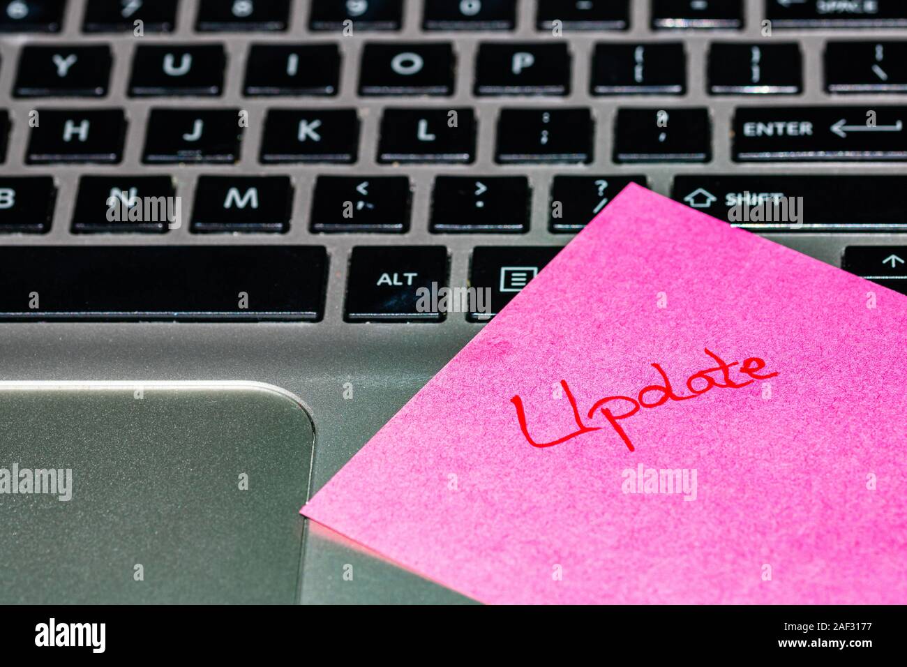 Writing on colorful sticky note Update. Text with Update on paper ...