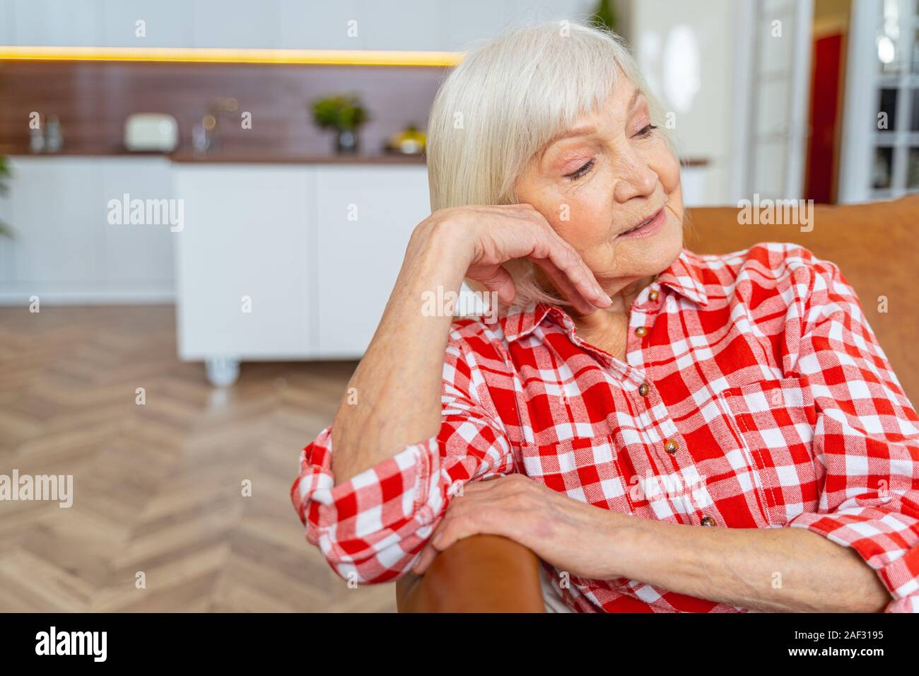 Female taking a rest on the couch Stock Photo - Alamy