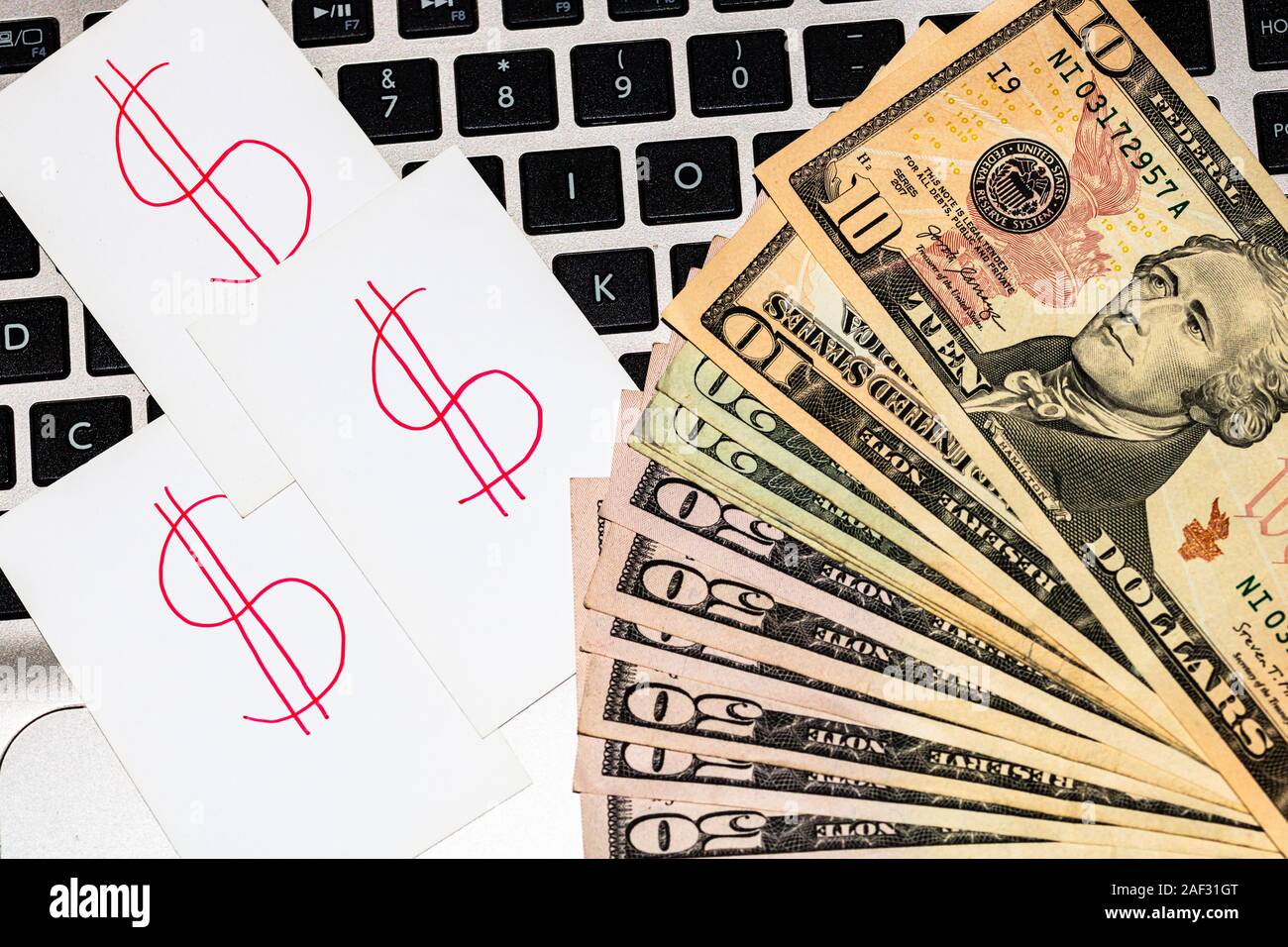 Writing on white label dollar sign. Dollars and white labels on ...